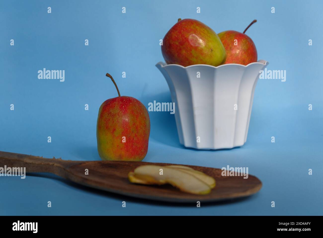 A split apple with a blue background, a perfect photo for a food ...