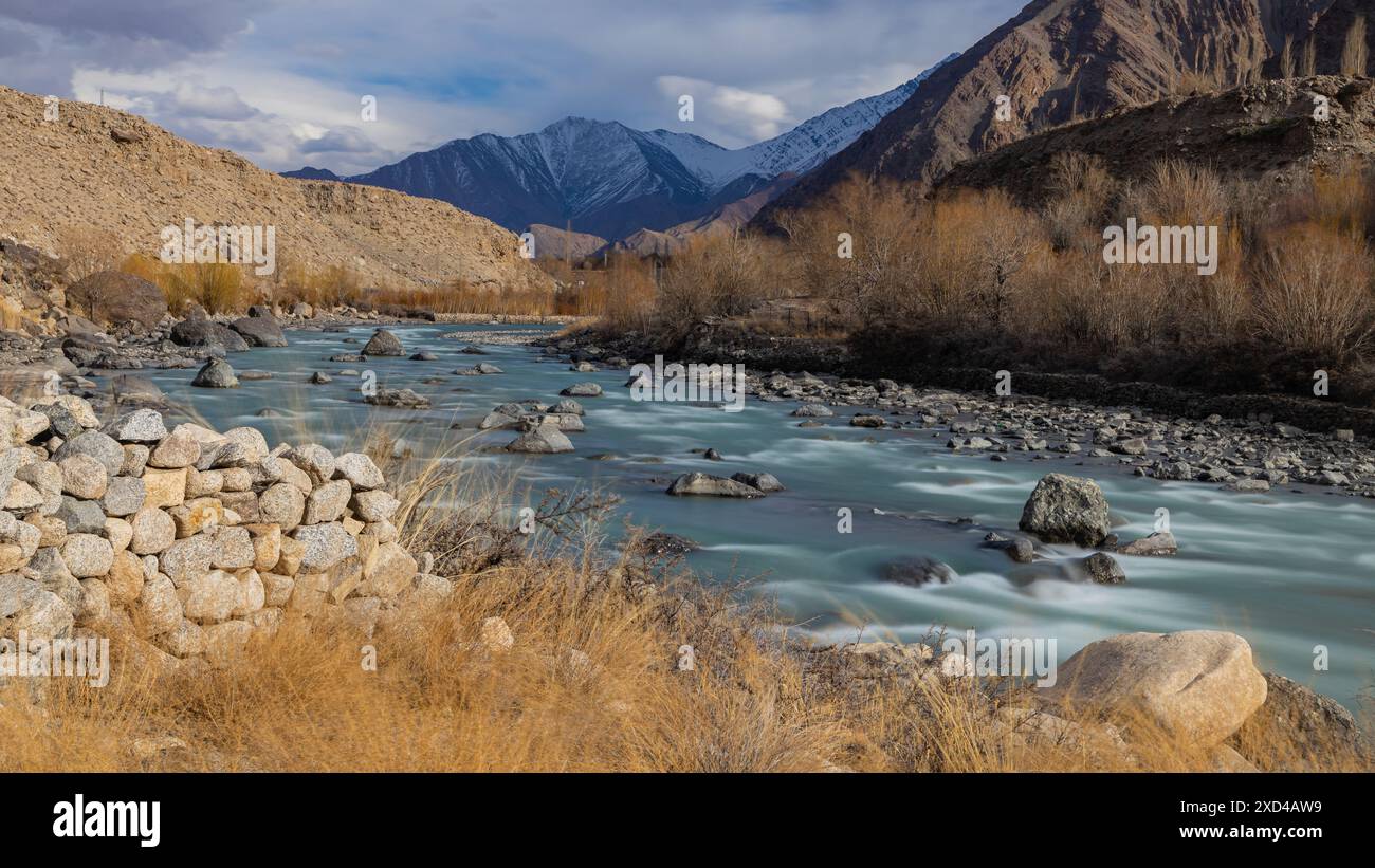 Clear blue water of Indus River flowing in between high-altitude ...