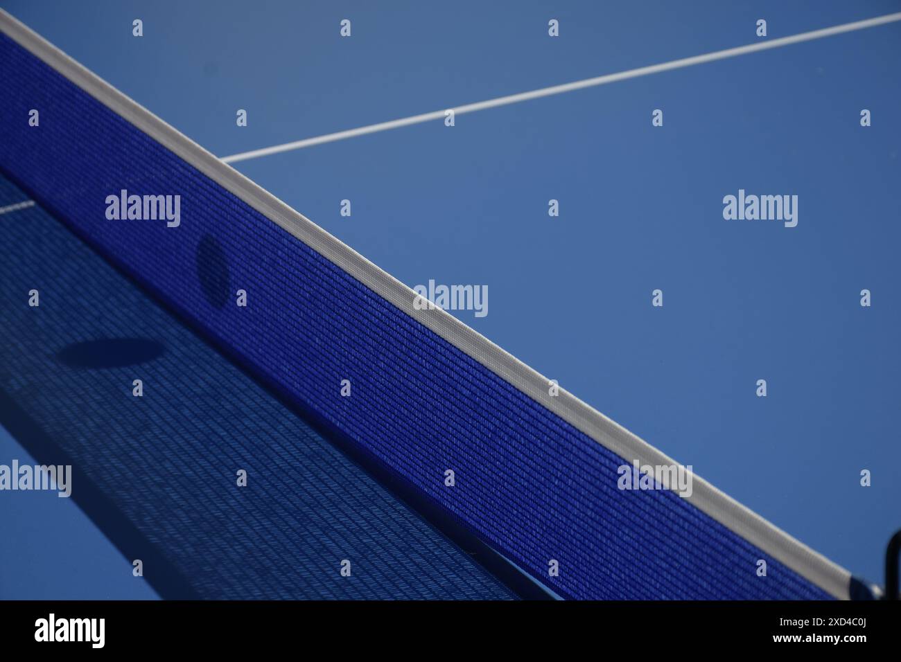 Blue ping pong table with shadow of the ball on the net Stock Photo - Alamy