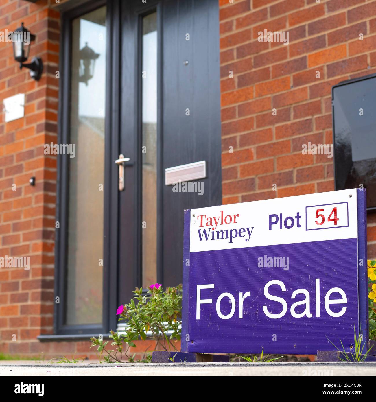 Sold plot sign on a new build house for Taylor Wimpey Homes Stock Photo ...