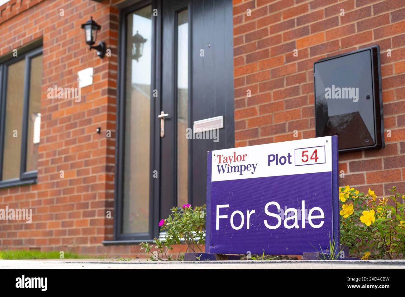 Sold plot sign on a new build house for Taylor Wimpey Homes Stock Photo ...