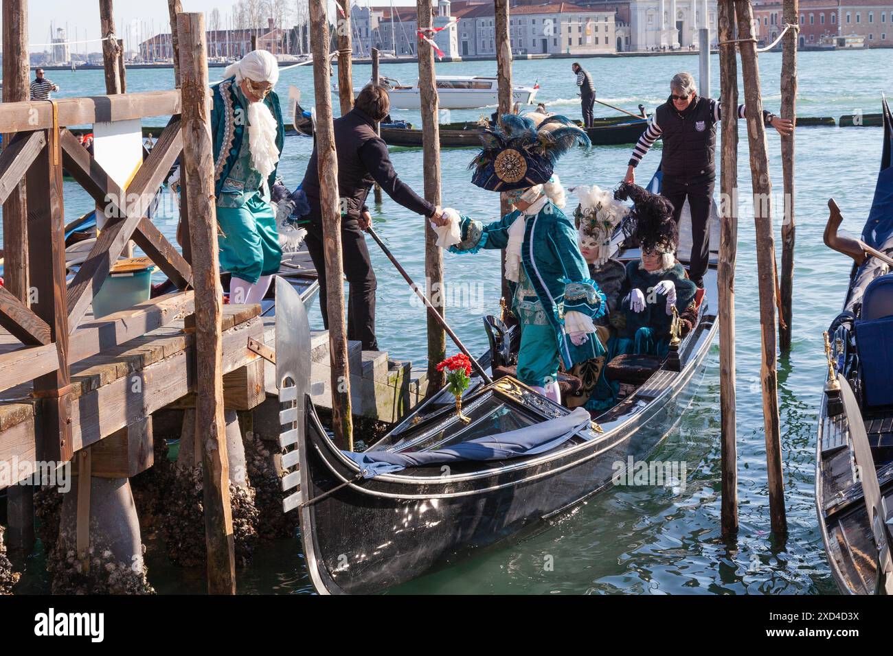People in historic costumes disembarking from a gondola during Venice ...