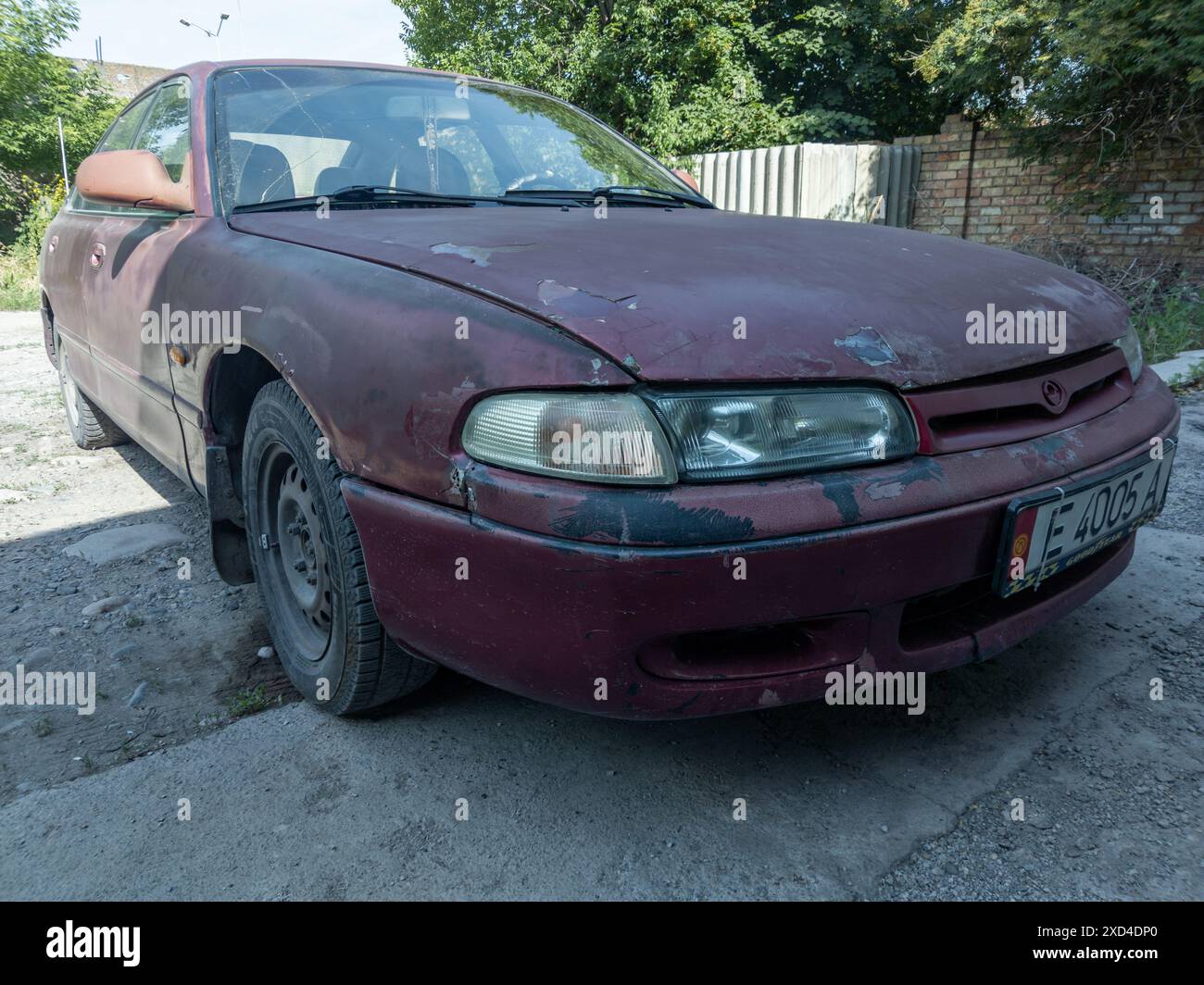 heavily used falling apart car at the street of Central Asia Stock ...