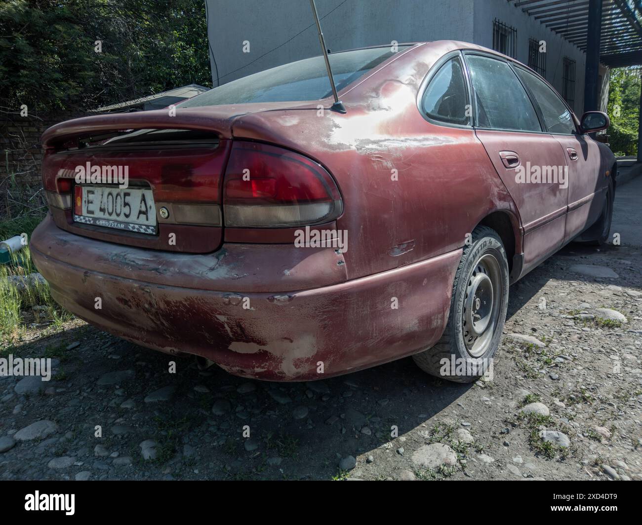 heavily used falling apart car at the street of Central Asia Stock ...