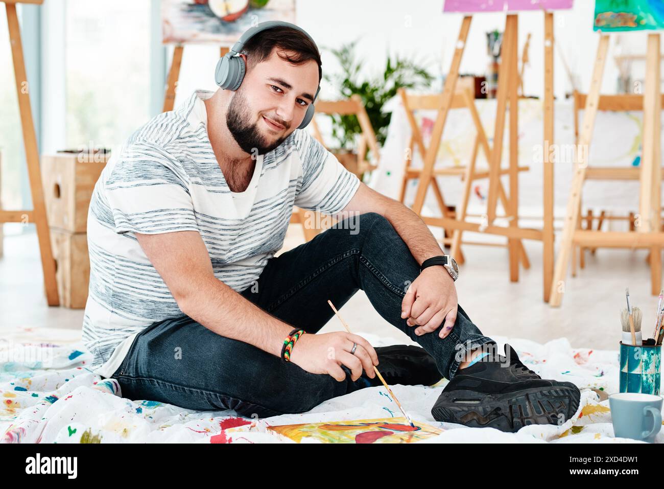 Workshop, man and portrait with paintbrush for painting, creativity and ...