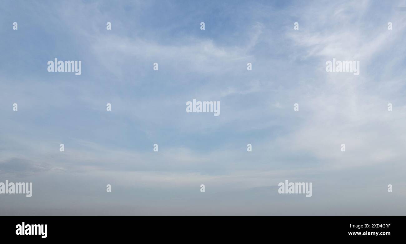 Blue sky background with foggy clouds in atmosphere Stock Photo - Alamy