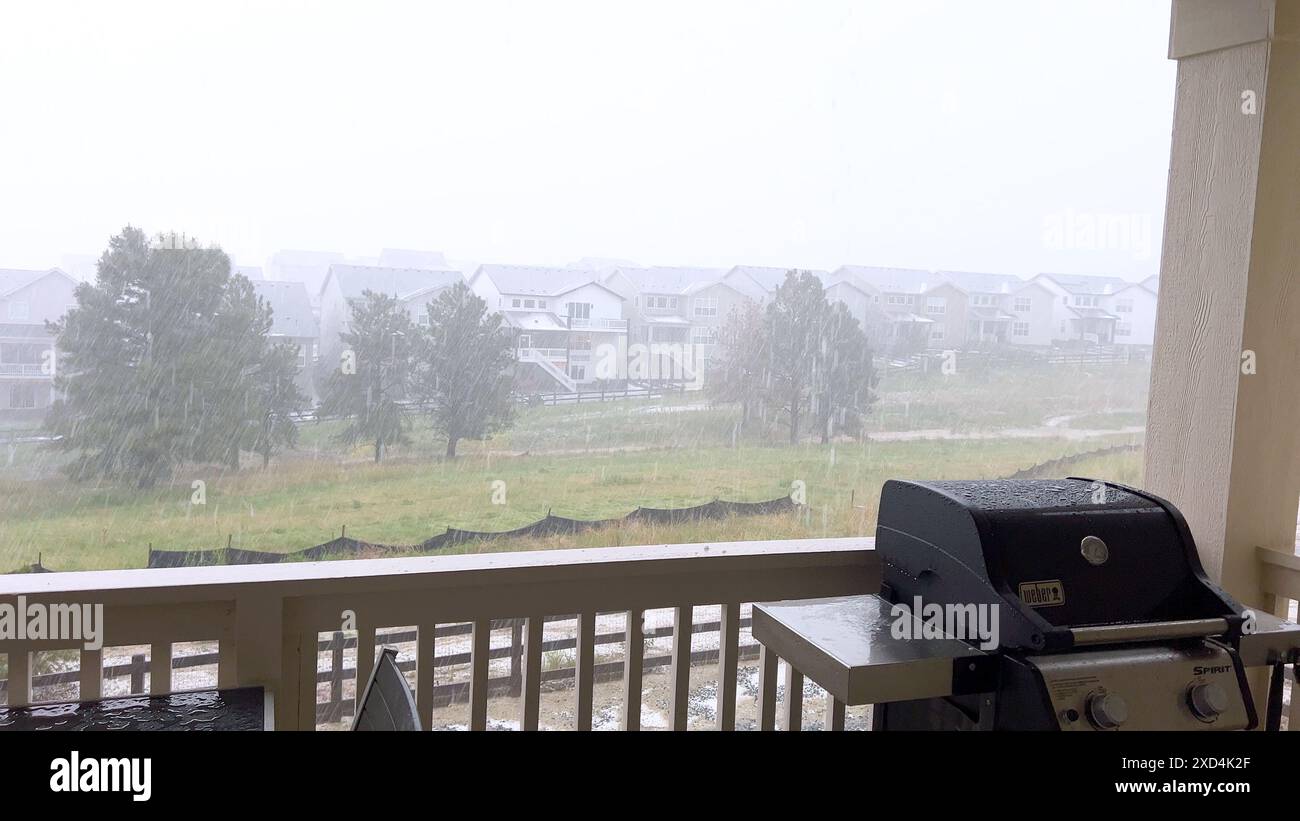Hail Storm on Wooden Deck with Patio Furniture Stock Photo - Alamy