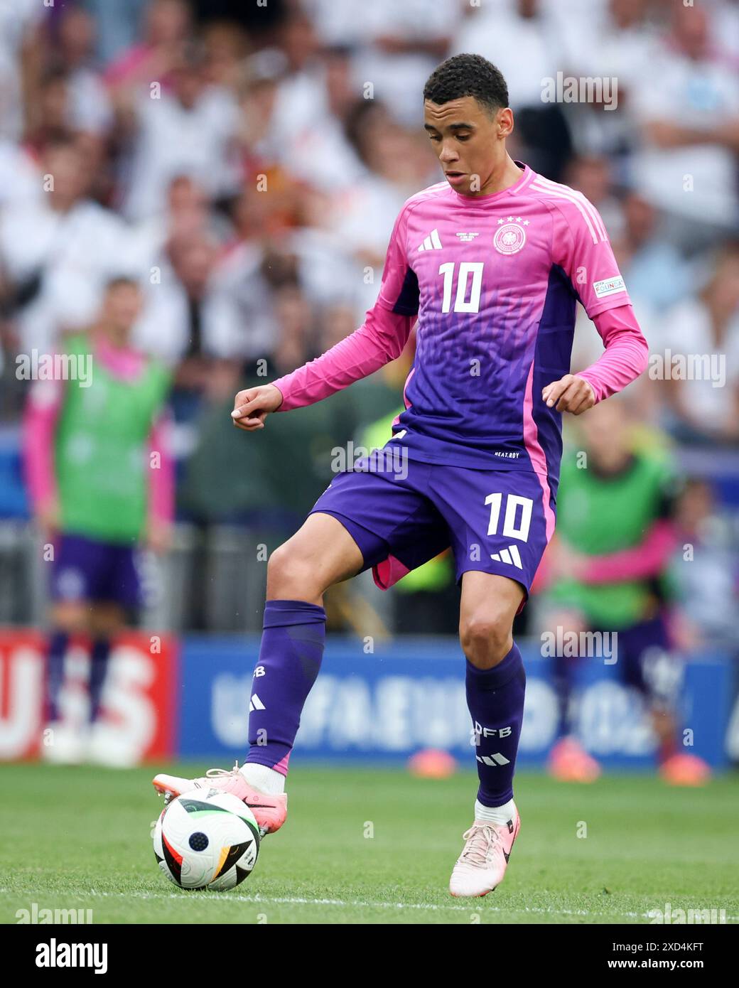 STUTTGART, GERMANY - JUNE 19: Jamal Musiala of Germany runs with a ball ...