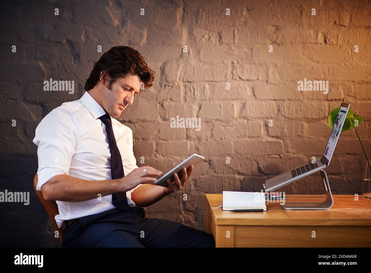 Desk, investigation and technology with detective man in office at ...