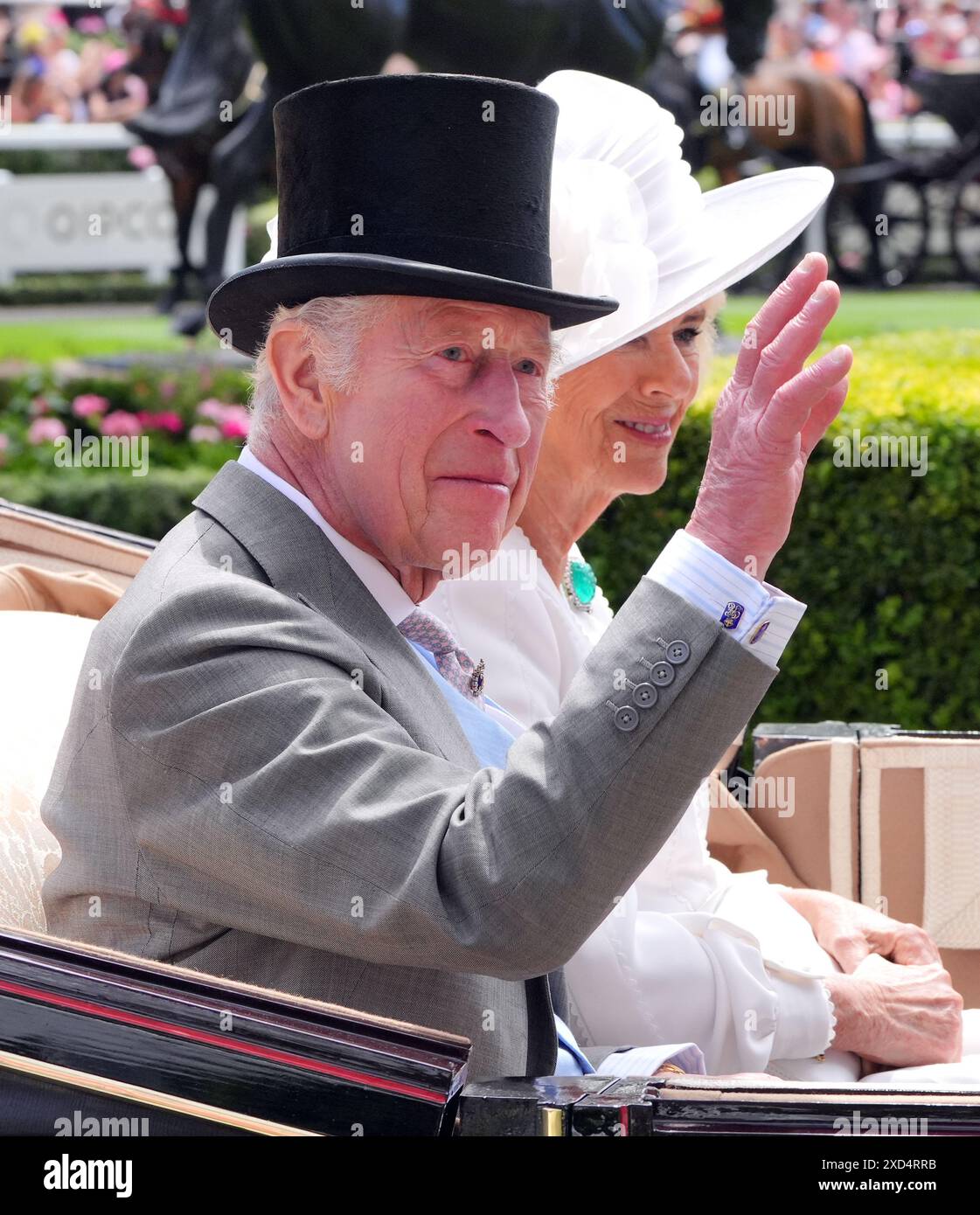 King Charles III (left) and Queen Camilla arrive by carriage on day ...