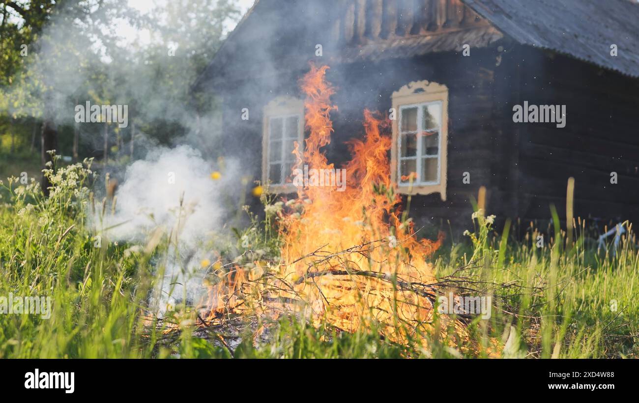 Burning branches outside the village house in eastern europe Stock Photo - Alamy