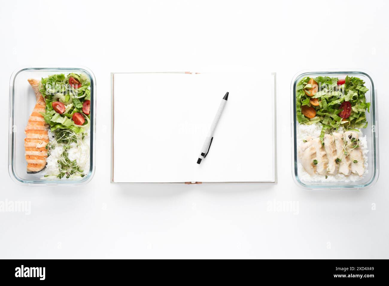 Healthy food. Open notebook, pen and different meals on white ...