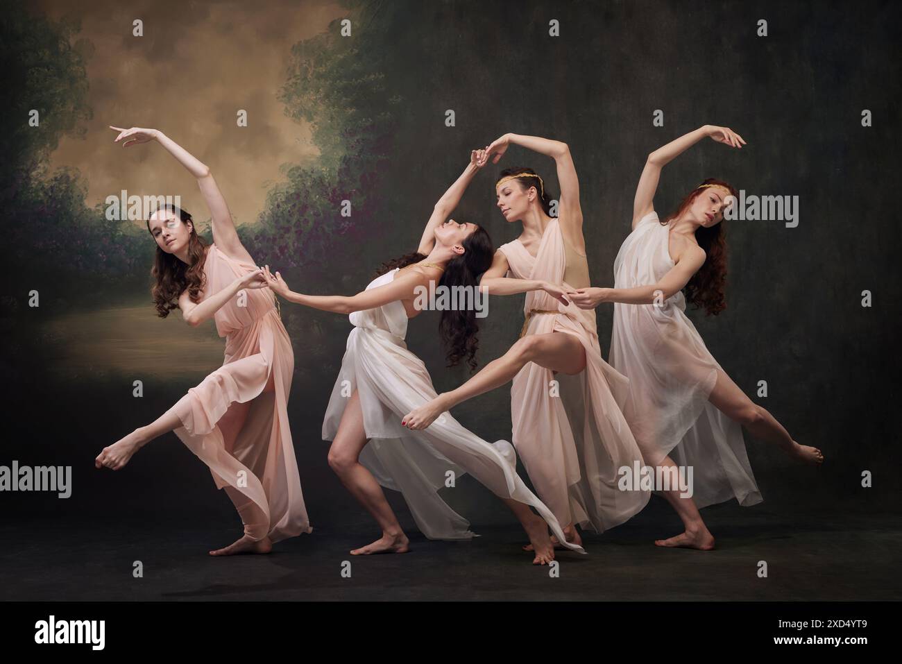 Timeless Grace. Quartet of ballerinas in elegant dresses perform ...