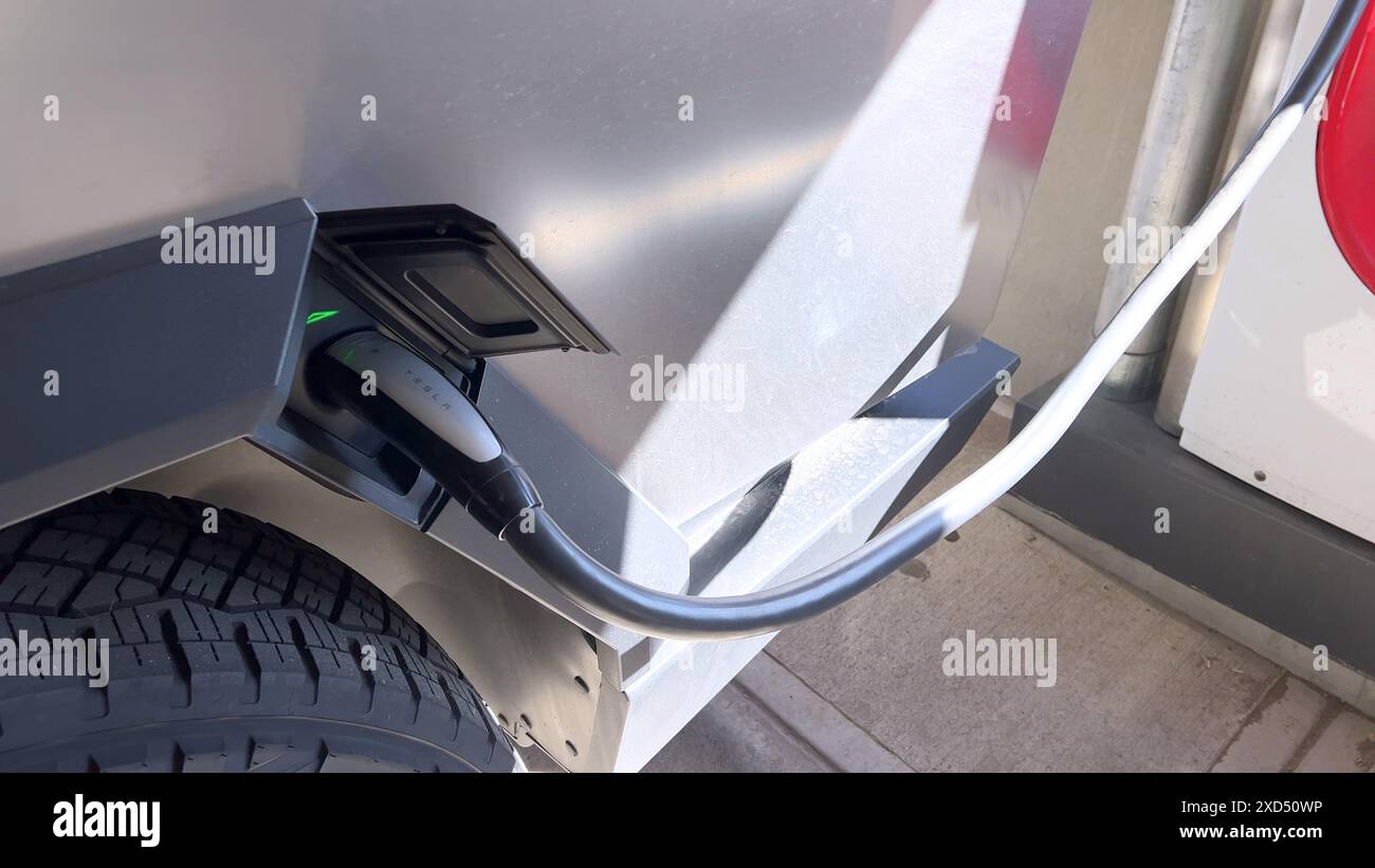 Tesla Cybertruck Charging at Supercharger Station Stock Photo - Alamy