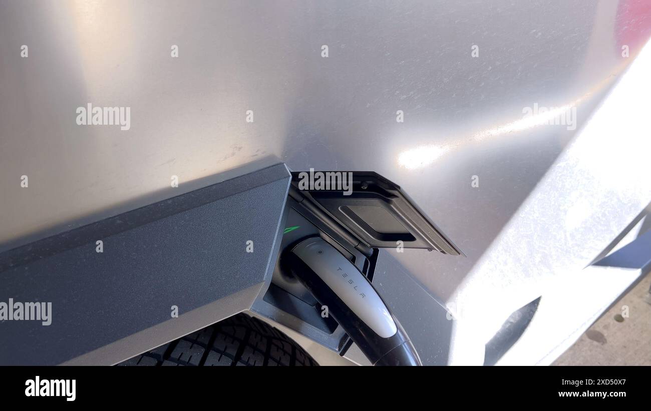 Tesla Cybertruck Charging at Supercharger Station Stock Photo - Alamy