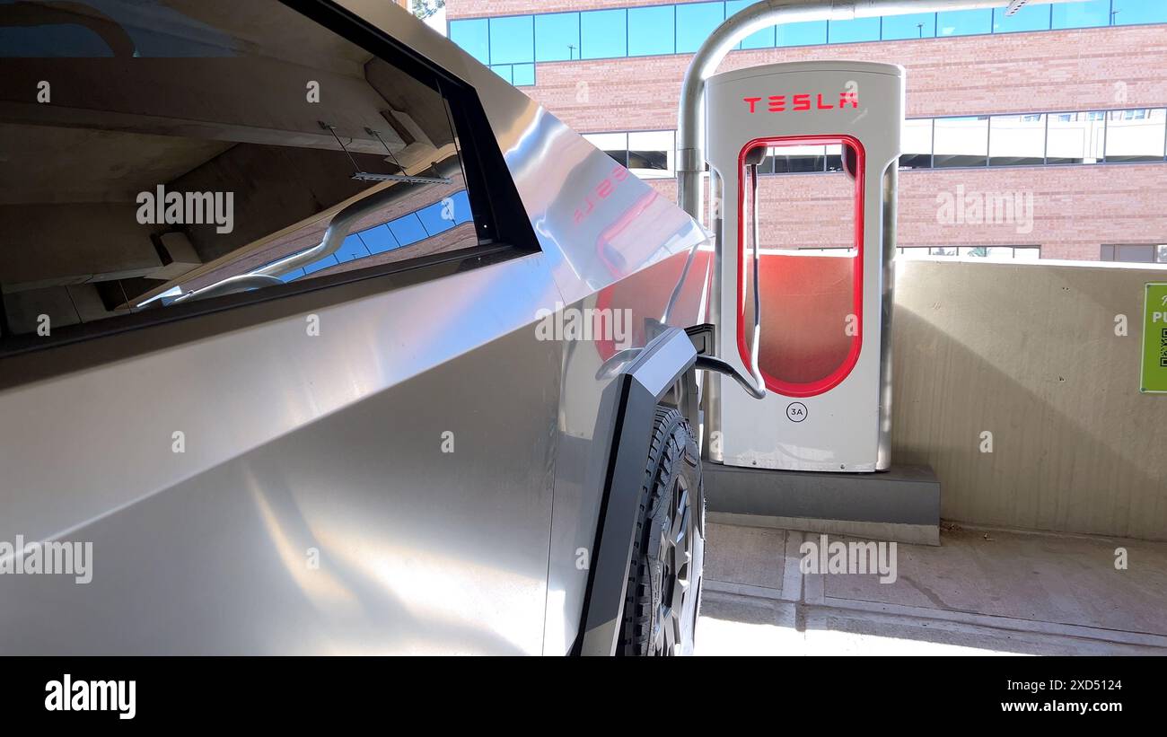 Tesla Cybertruck Charging at Supercharger Station Stock Photo - Alamy