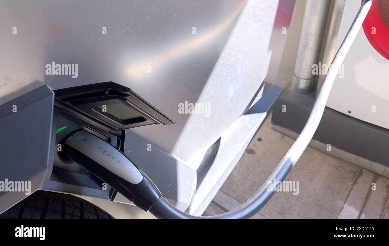 Tesla Cybertruck Charging at Supercharger Station Stock Photo - Alamy