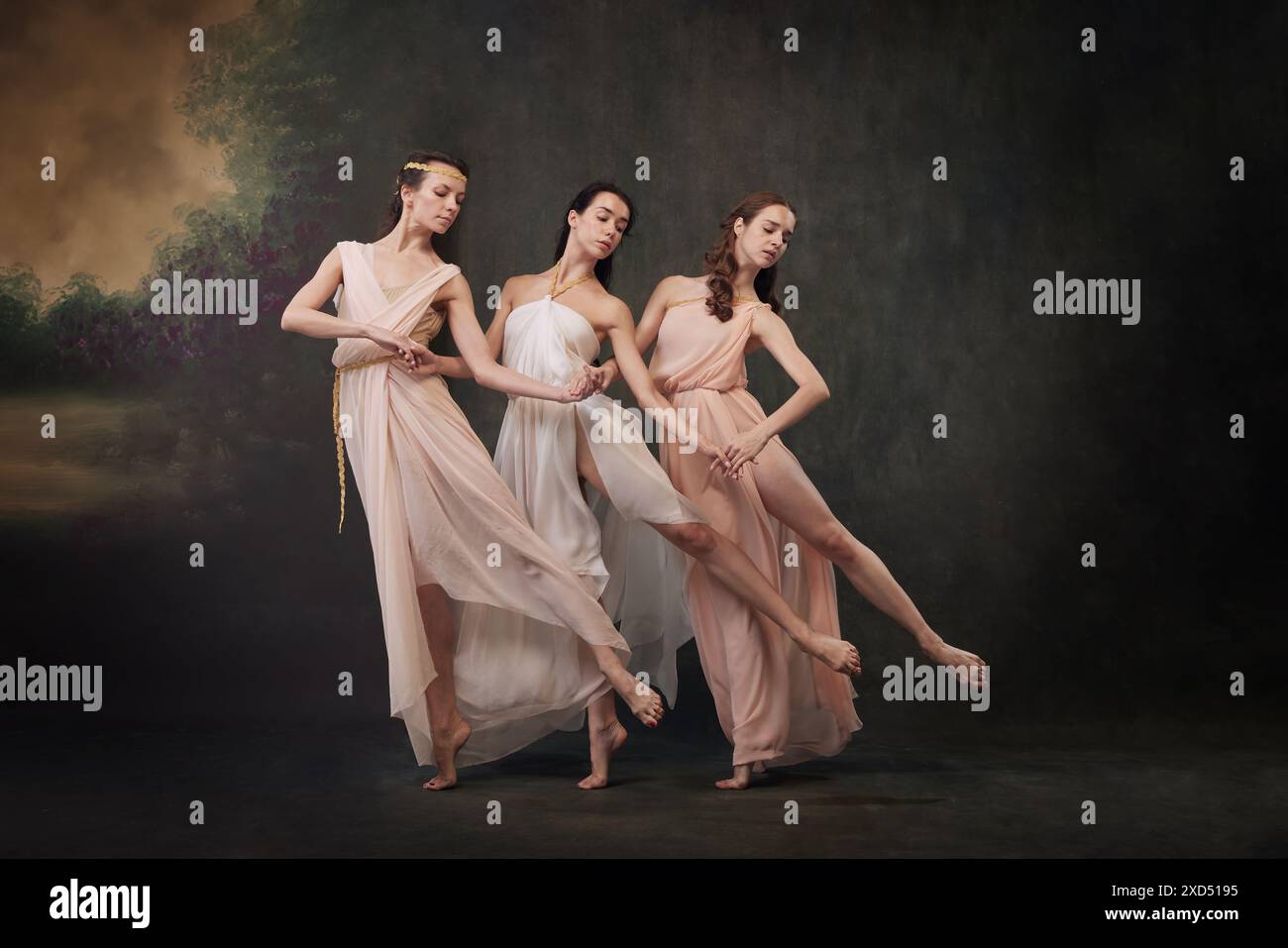 Group portrait of beautiful ballerinas in flowing dresses dancing ...