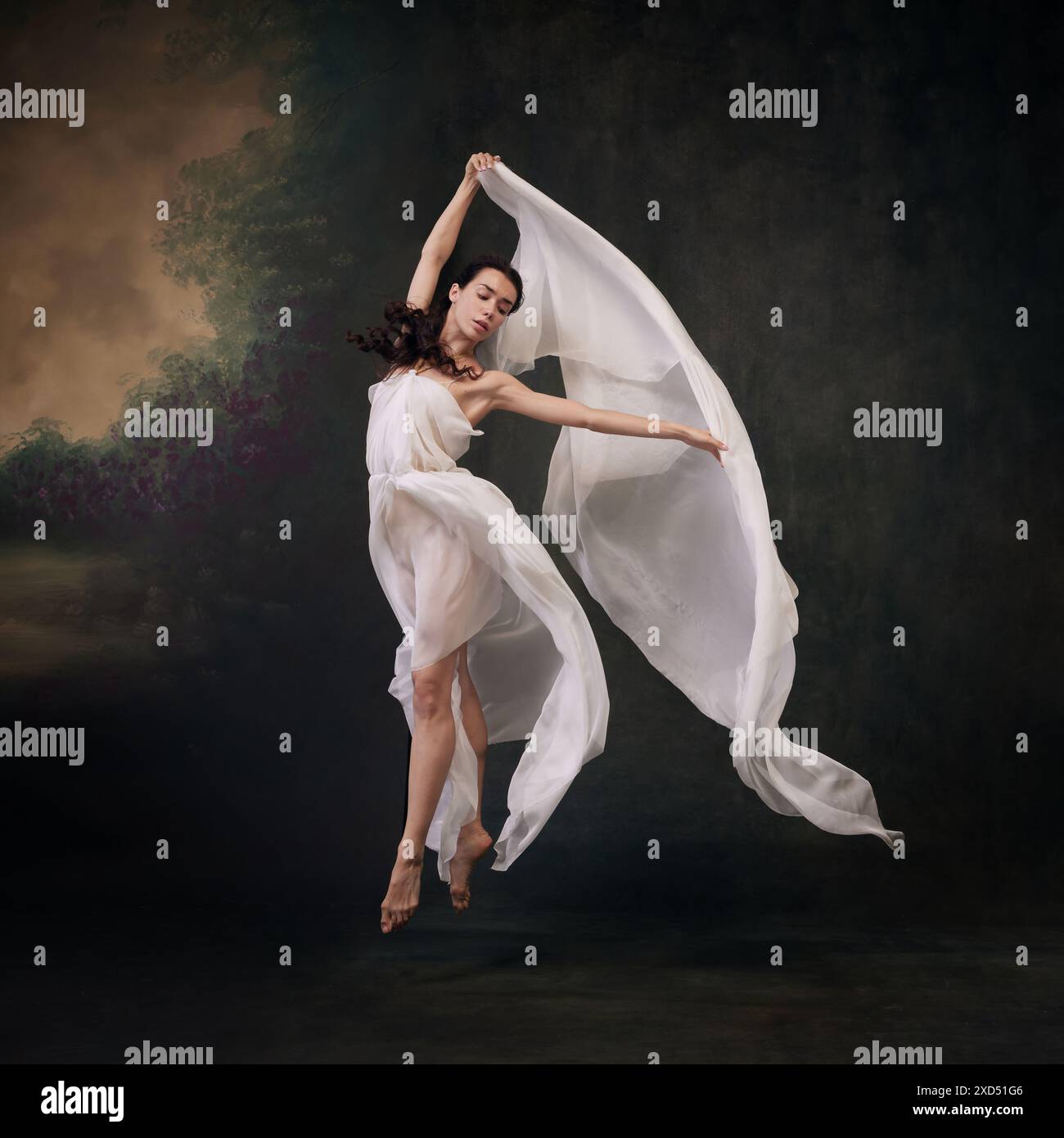 Draped in delicate fabric, dancer embodies lightness and fluidity in ...