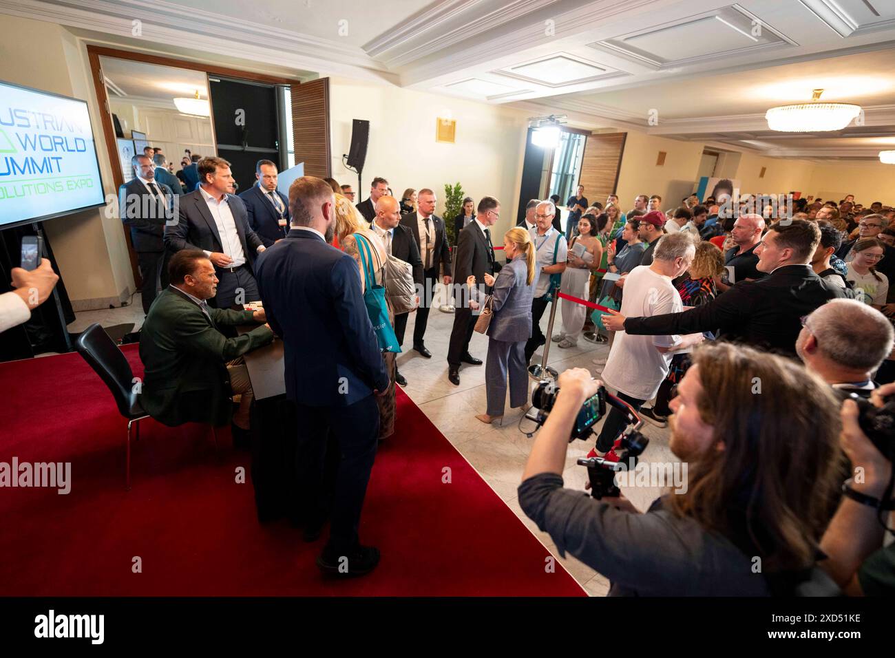 ARNOLD SCHWARZENEGGER signing copies of his book BE USEFUL: SEVEN TOOLS ...