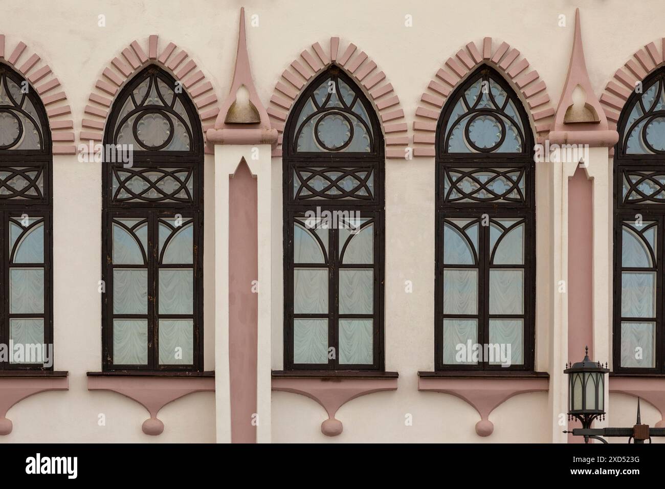 A row of Gothic style windows decorated with stucco Stock Photo - Alamy