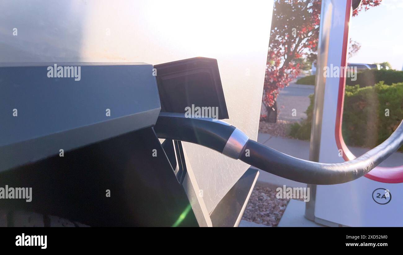 Tesla Cybertruck Charging at Outdoor Supercharger Station Stock Photo ...