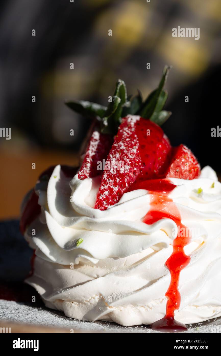 Pavlova cake with strawberries. Anna Pavlova dessert of meringue and ...