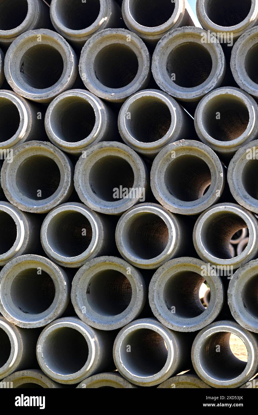 Stacked concrete pipes on plant grounds Stock Photo - Alamy