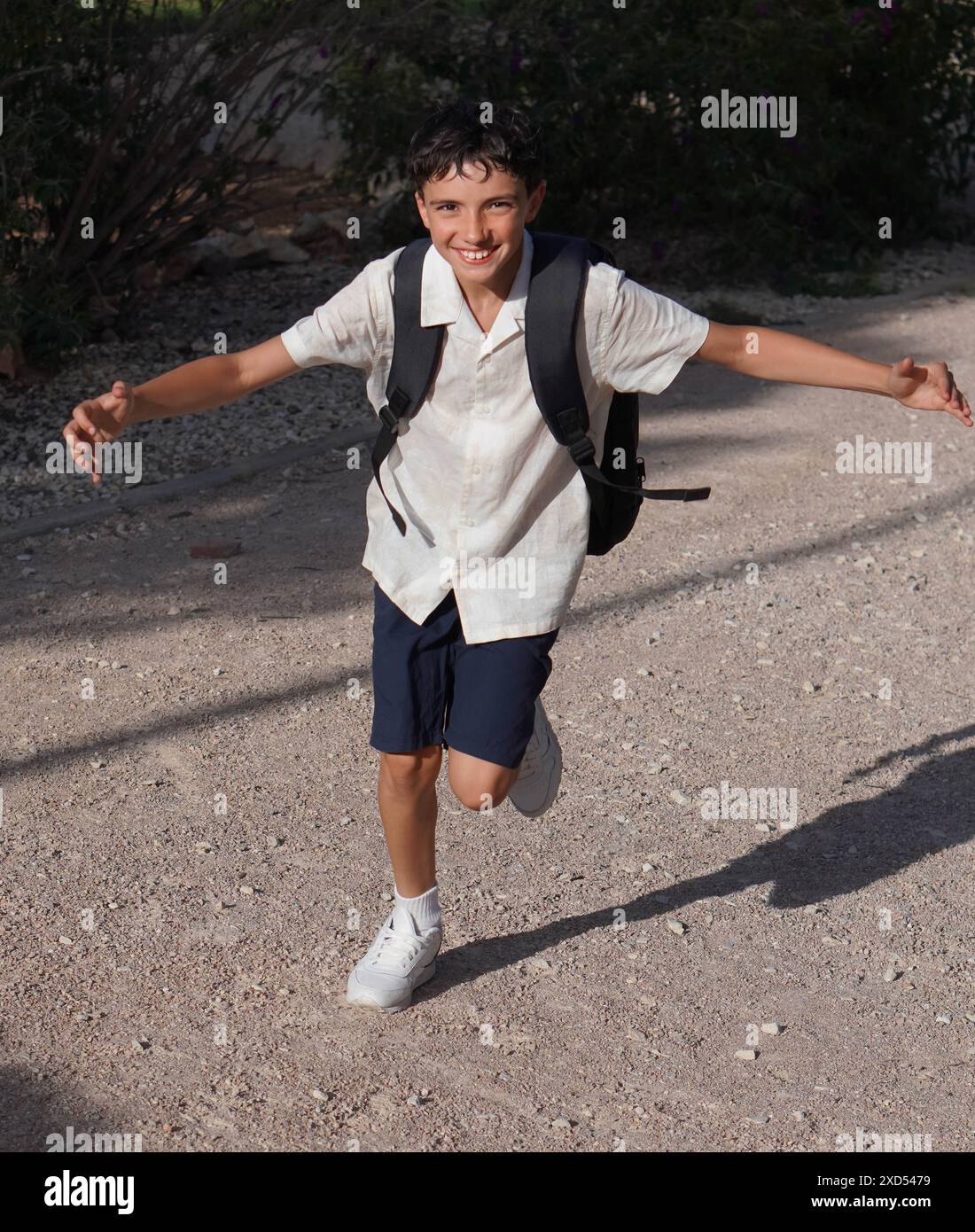 boy running with his back to school bag Stock Photo - Alamy