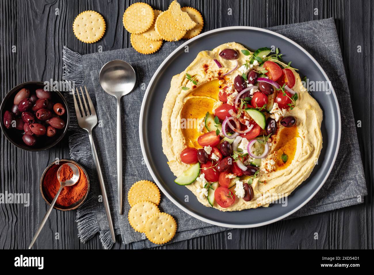 Greek hummus loaded with fresh cucumbers, olives, tomatoes, feta cheese ...