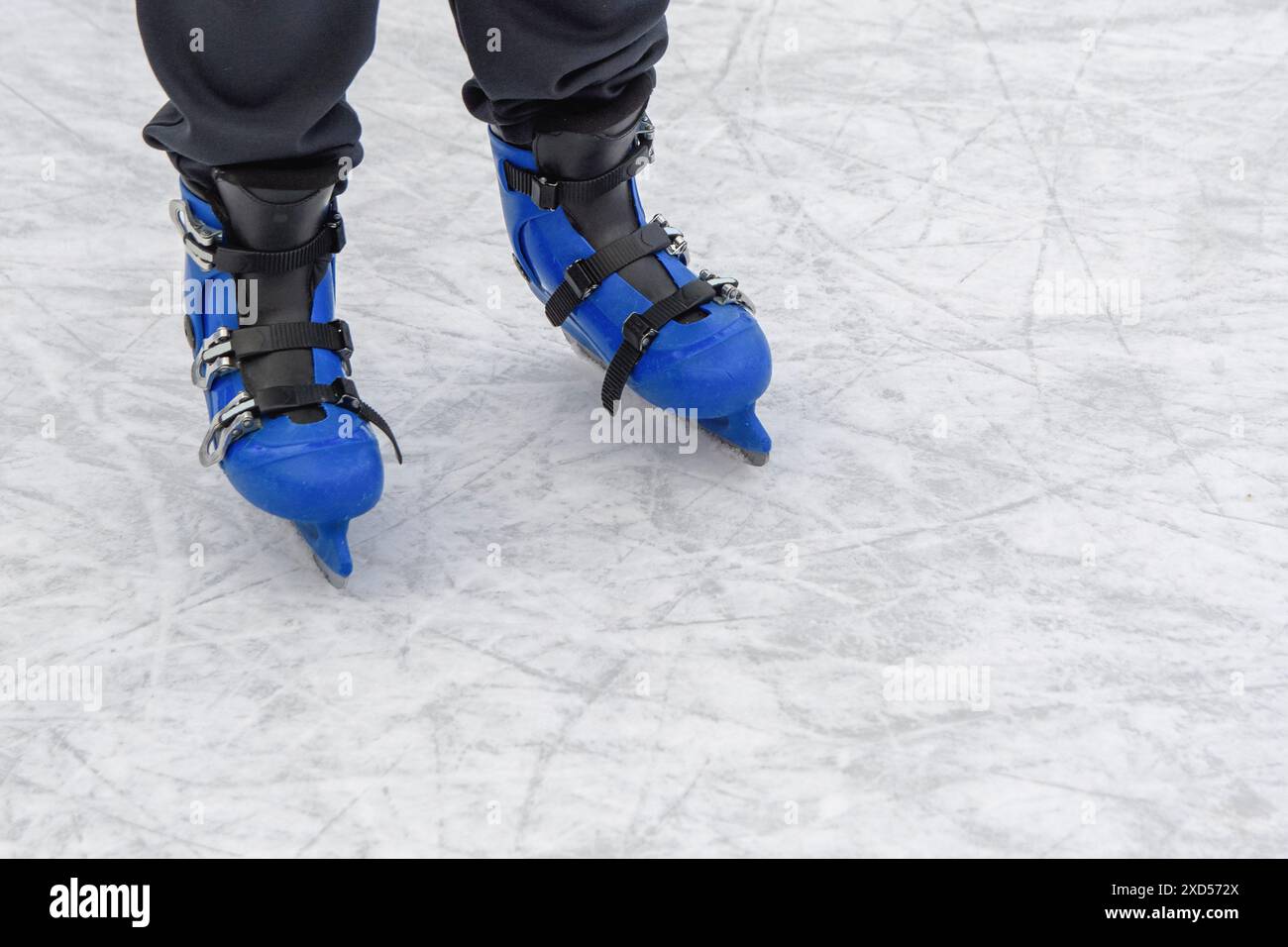 Modern skates with triple fastening on the legs of a teenager on the ...