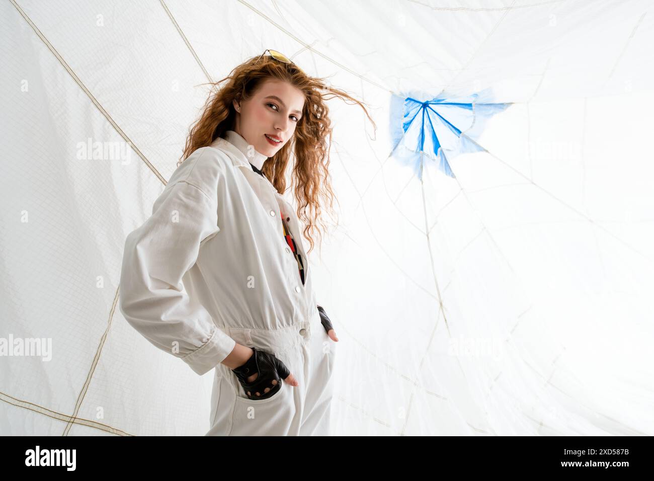 Woman in white jumpsuit poses hi-res stock photography and images - Alamy