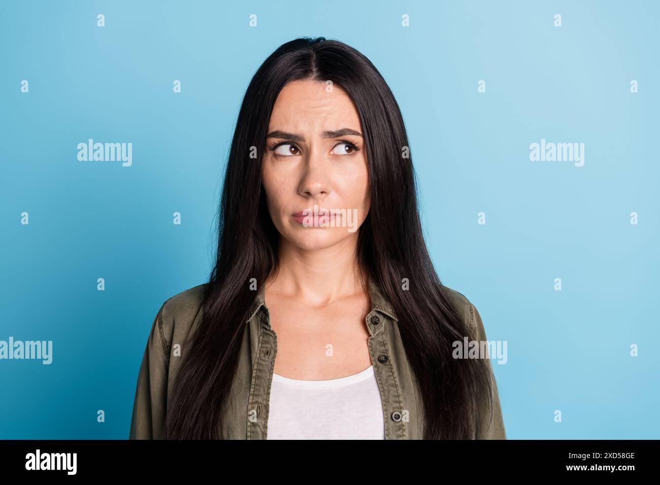 Photo of unsatisfied young woman sullen face look empty space wear ...