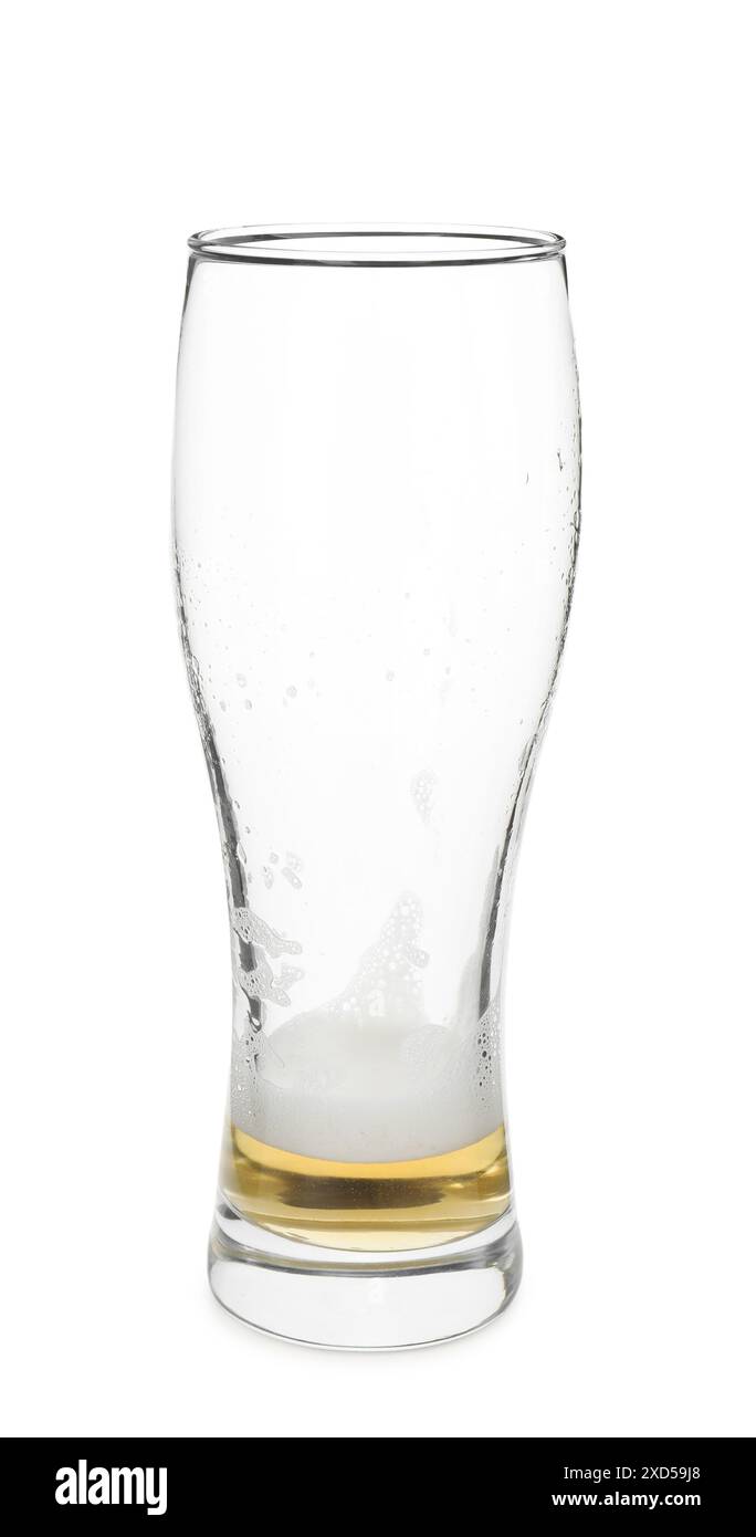 Almost empty glass of beer isolated on white Stock Photo - Alamy