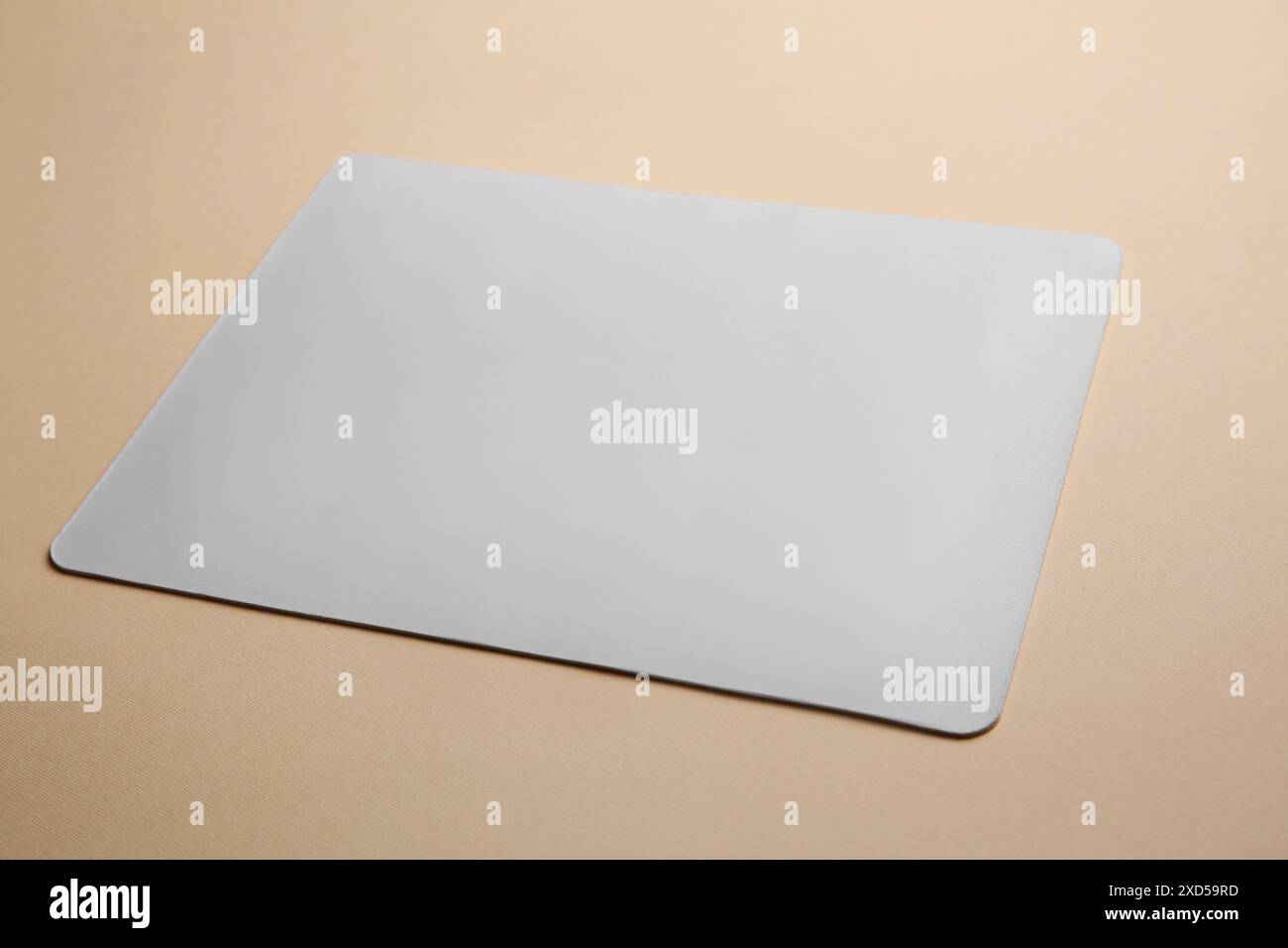 One mouse pad on beige background, closeup. Space for text Stock Photo ...