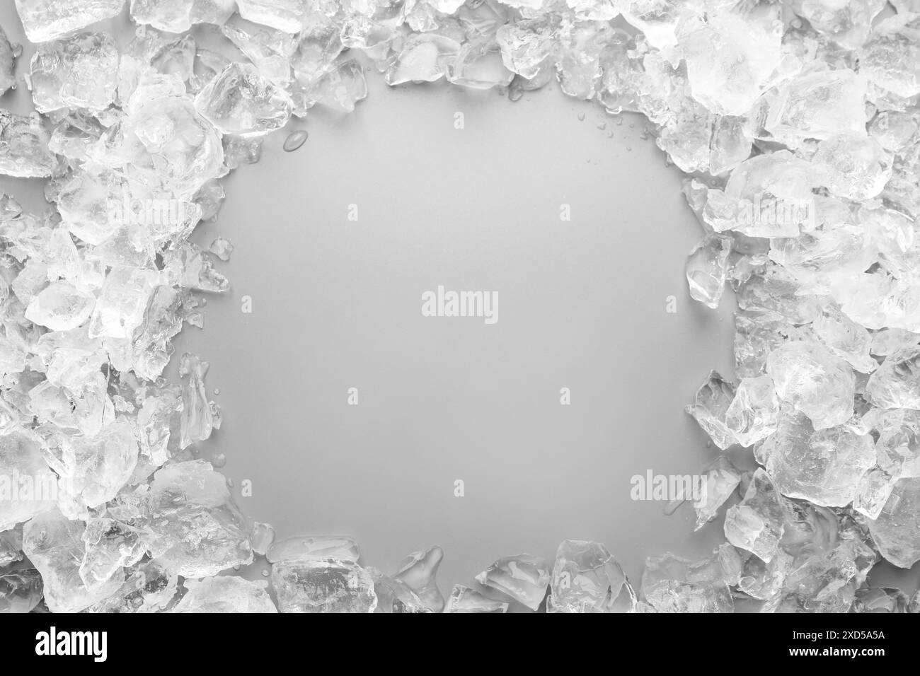 Frame of crushed ice on grey background, top view. Space for text Stock ...