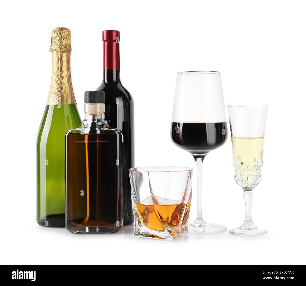 Bottles and glasses with different alcoholic drinks isolated on white ...