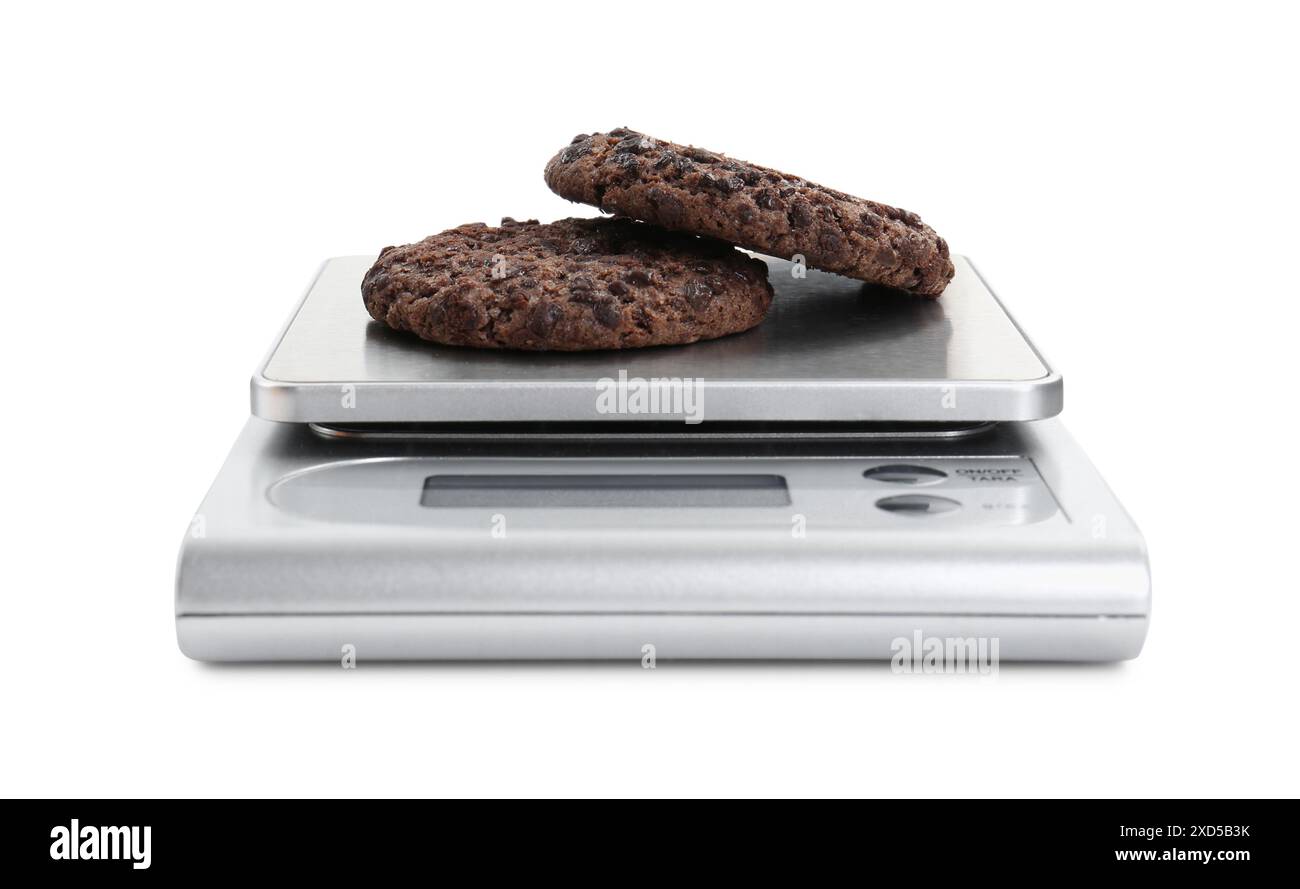 Kitchen scale with chocolate cookies isolated on white Stock Photo - Alamy