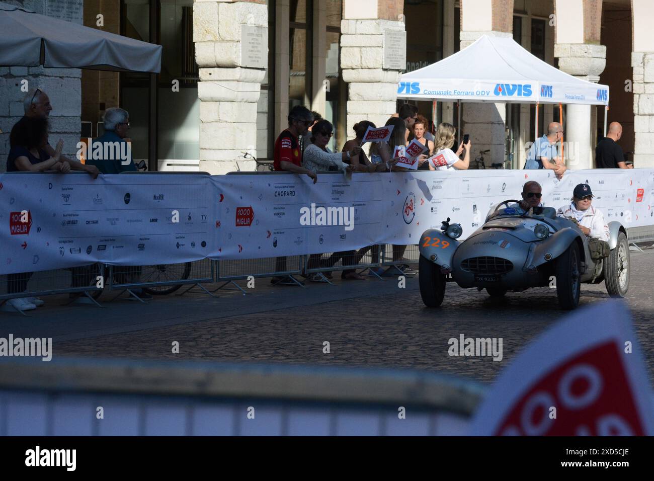 FERRARA , ITALY - jun 15 -2024 : A classic car races through the ...