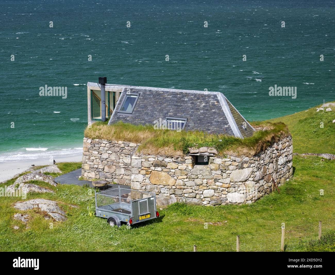 A modern house built in the remains of an old black house on Eriskay in ...