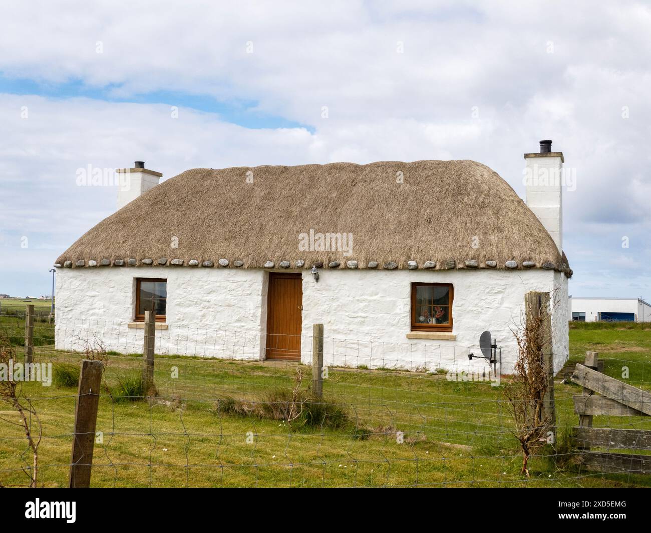 A traditional thatched black house at Baile a Mhanaich on Benbecula, Outer Hebrides, Scotland ...