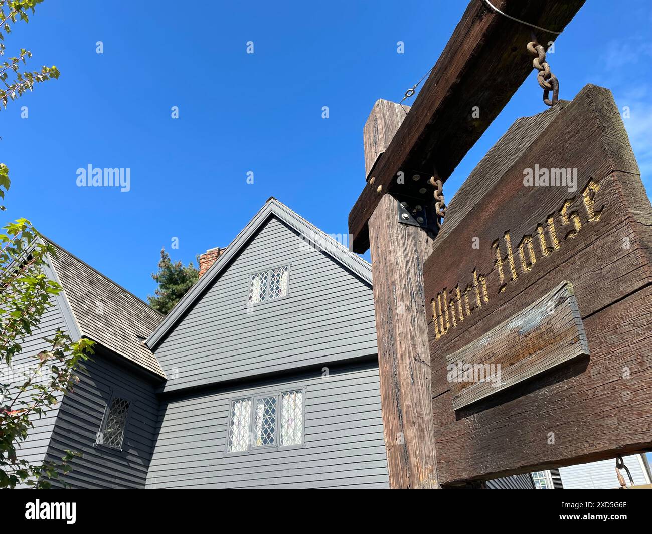 A sign in front of the Witch House in Salem Massachusetts is decorated ...