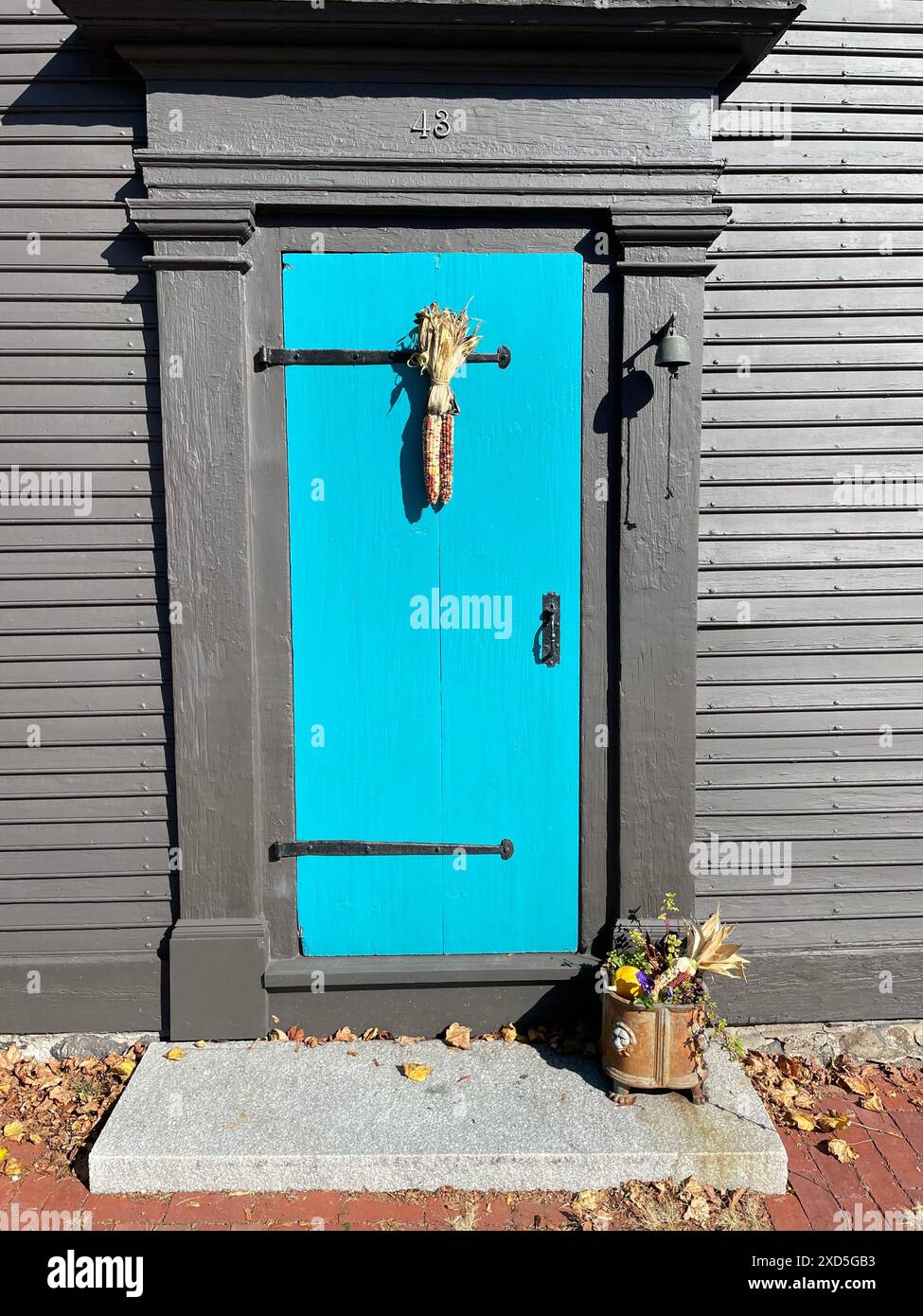 A bright blue door is decorated with fall items ahead of Halloween in ...