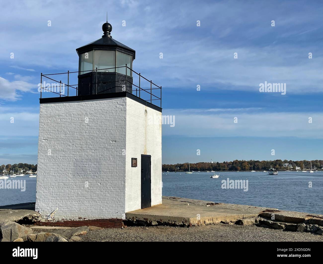 The small, square Derby Inlet lighthouse stands at the end of a jetty ...