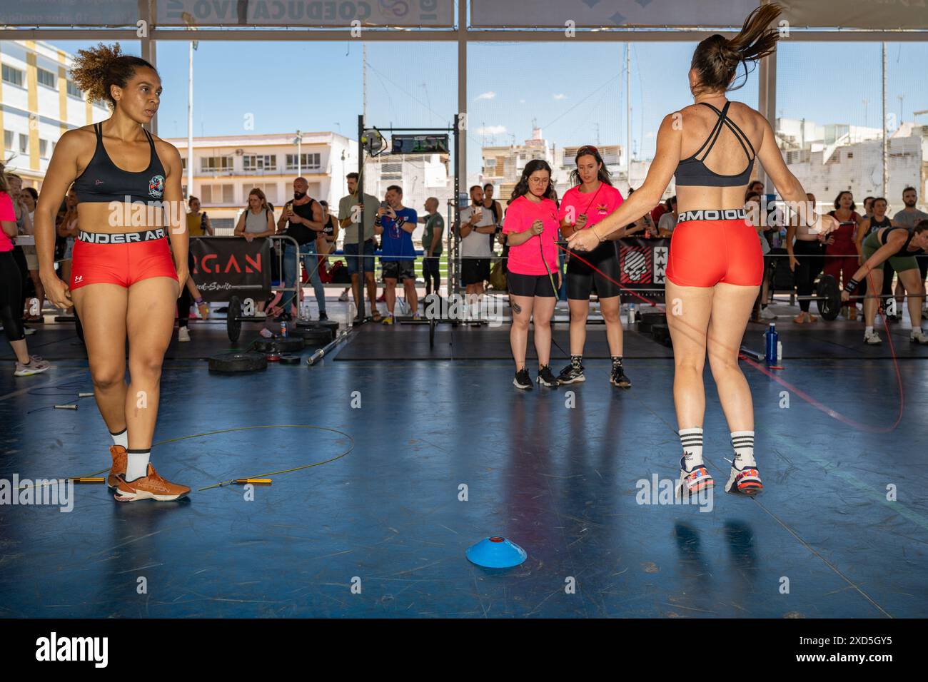 Athlete performs jump rope exercise at a CrossFit competition in ...