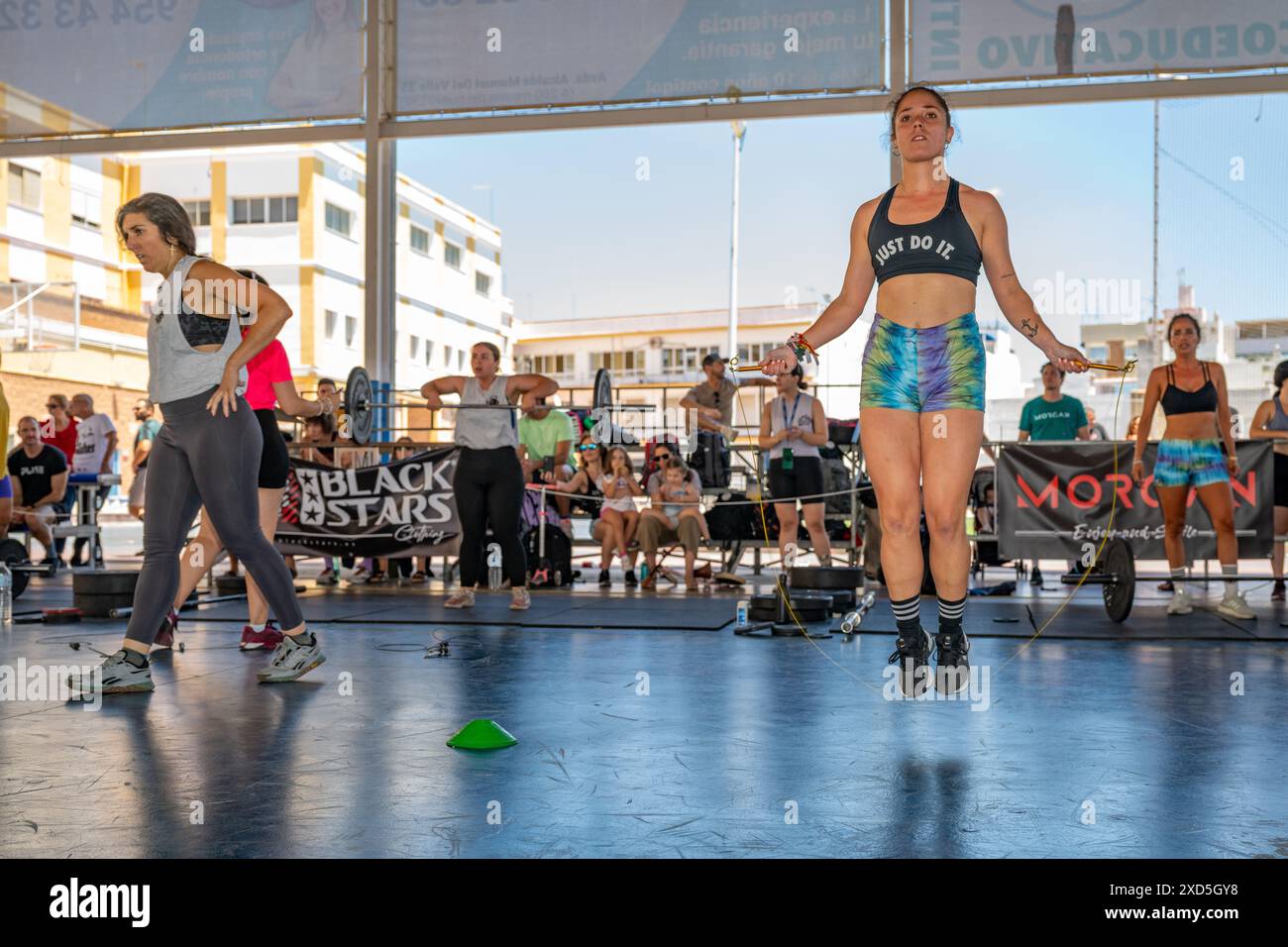 Athlete performs jump rope exercise at a CrossFit competition in ...