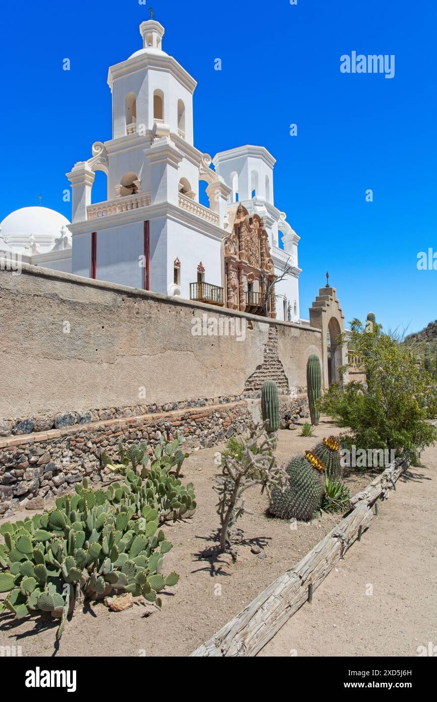 Cactus gardens outside adobe walls around San Xavier del Bac Mission ...