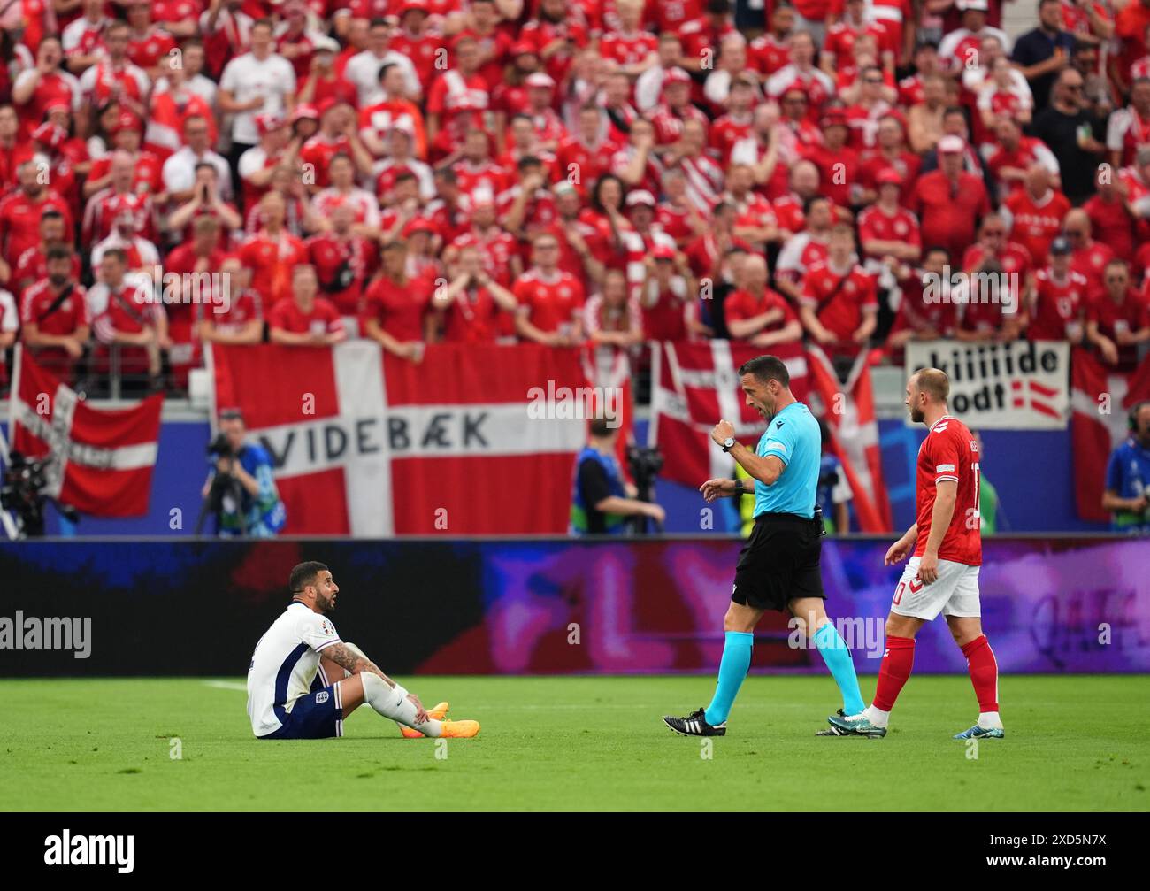England's Kyle Walker sitting after slipping on the loose turf during ...