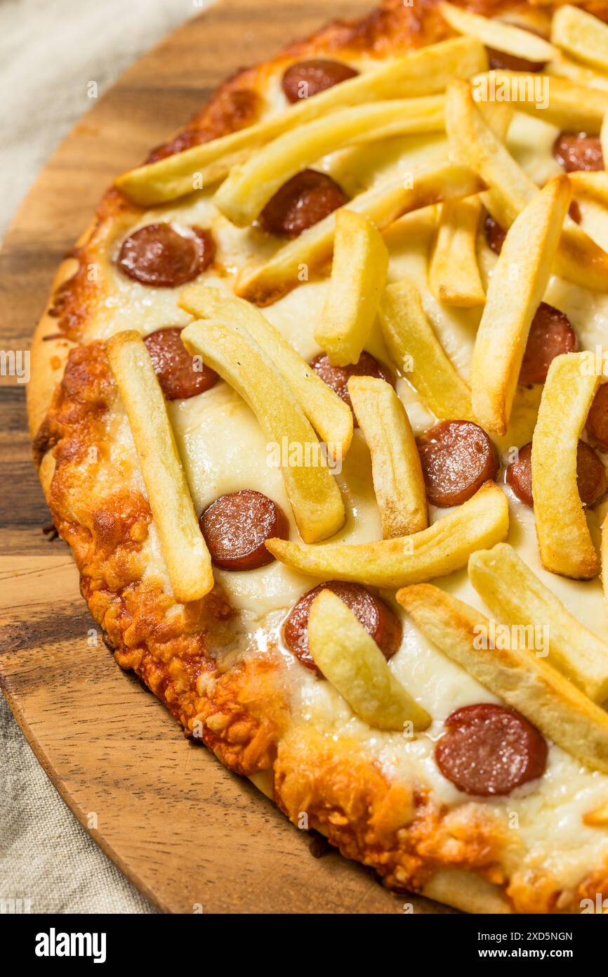 Homemade Italian Pizza Americano with French Fries and Hot Dogs Stock ...