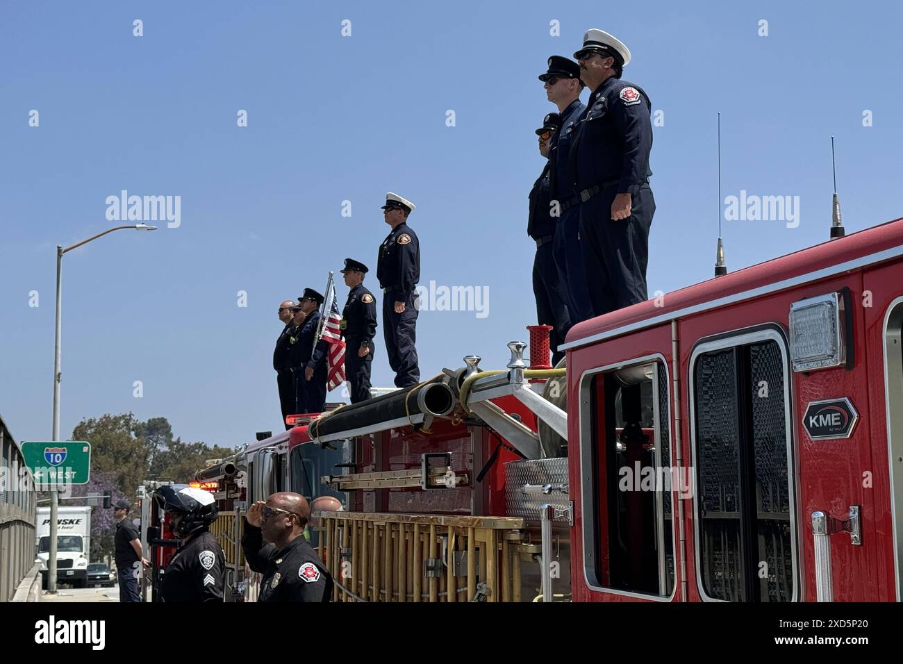 Los Angeles County and Monterey Park Fire Dept. firefighters stand in ...